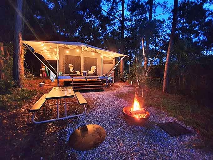 Twinkle lights transform canvas into magic as dusk falls, proving camping doesn't have to mean sacrificing that cozy ambiance.