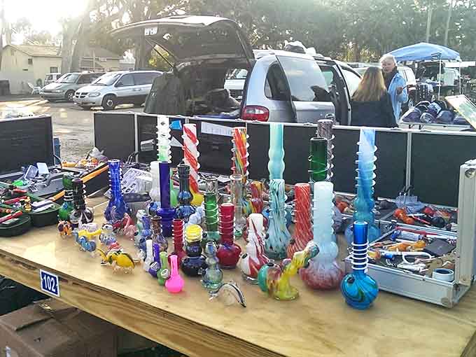 Colorful glass creations catch the Florida sunlight, transforming ordinary tables into kaleidoscopic displays that stop browsers in their tracks.