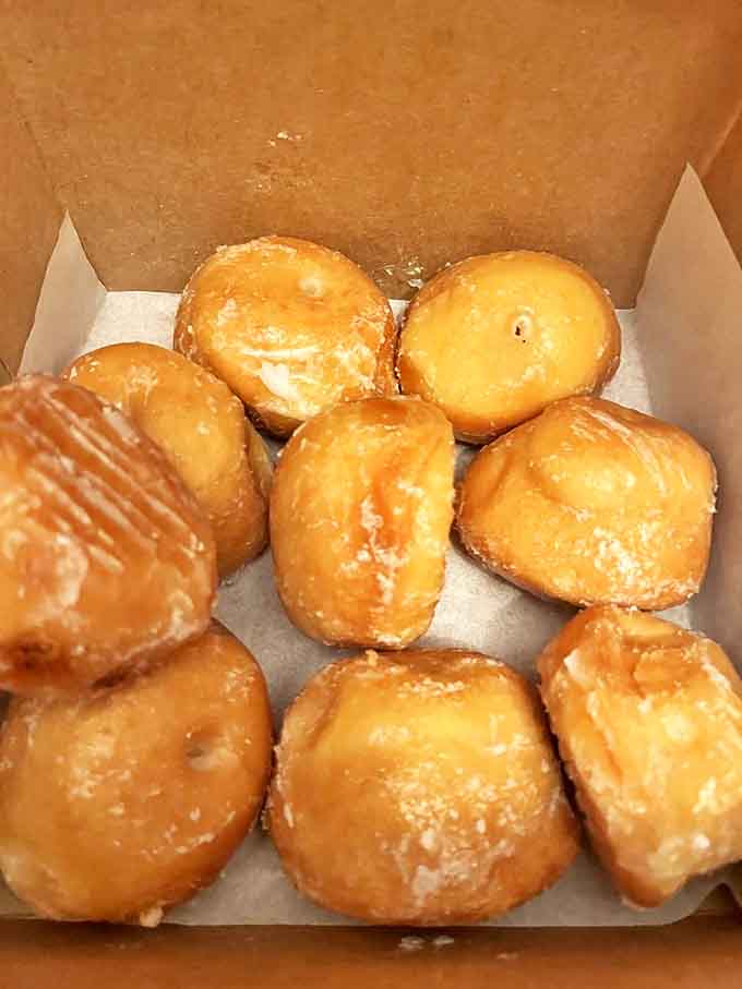 Glazed Donut Holes: A box of golden perfection &ndash; each glazed sphere glistening with sweet promise and weekend morning potential.