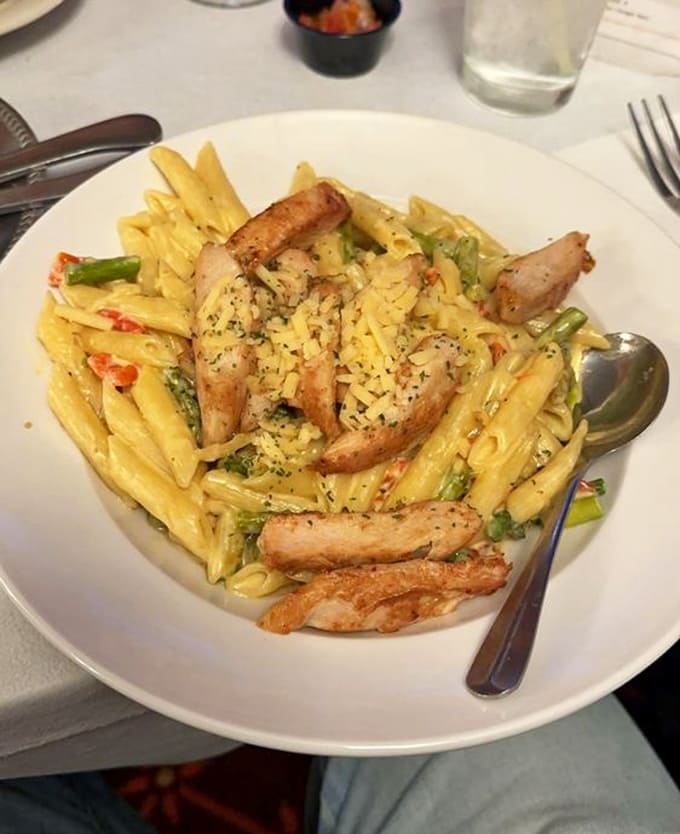 Gouda chicken pasta arrives loaded with asparagus and enough creamy goodness to make your cardiologist schedule a follow-up appointment.