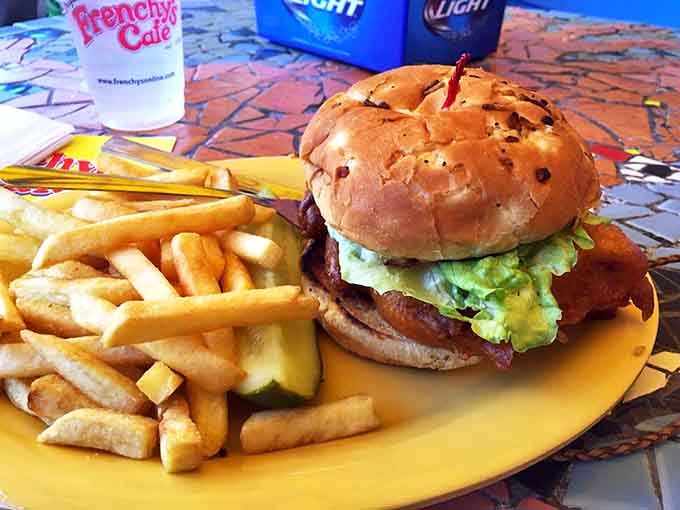 The burger-like presentation might fool you, but that golden-fried grouper with crispy fries delivers a taste experience uniquely Floridian.