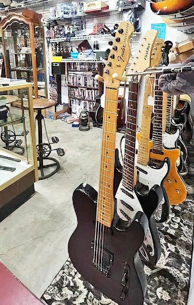 Guitars: Silent now, these vintage axes once provided the soundtrack to someone's glory days, waiting for new fingers to make them sing again.
