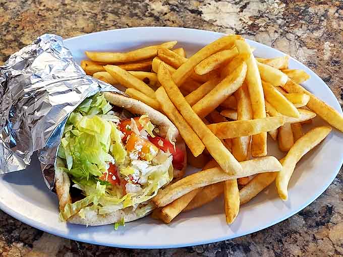 The classic gyro and fries combo, where crispy potatoes play the perfect supporting role to the Mediterranean star.
