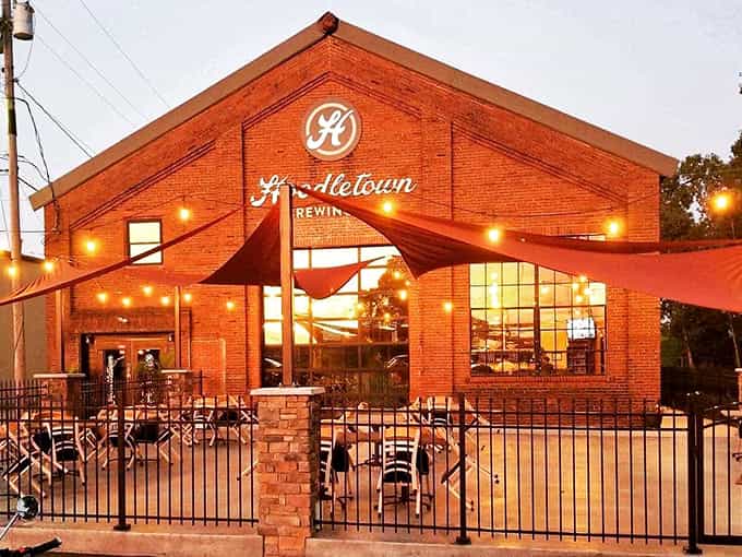 Hoodletown Brewing Company transforms a historic brick building into a gathering spot where craft beers flow and strangers become friends.