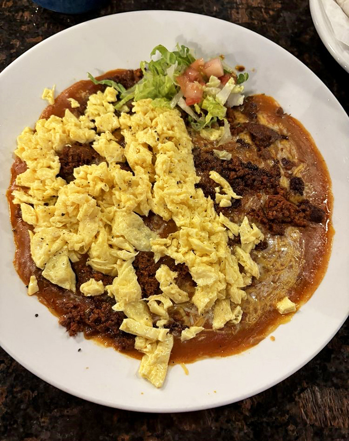 The chorizo version kicks things up a notch – spicy sausage crumbles playing hide and seek with eggs and that soul-satisfying sauce.