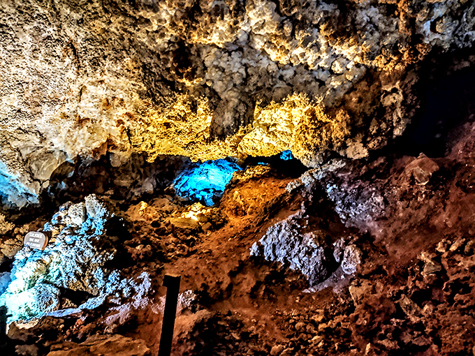The cavern's natural skylights create dramatic spotlights on mineral formations, illuminating millions of years of geological artistry in vibrant technicolor.