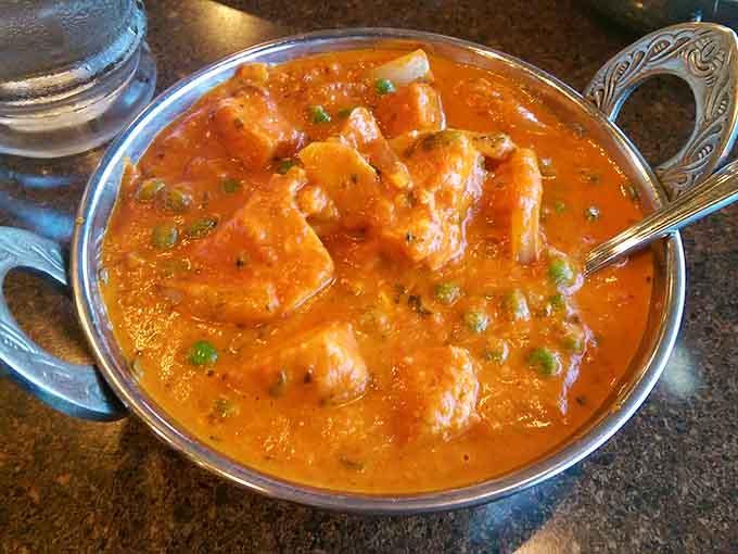 Chicken tikka masala done right, with tender chunks of tandoor-cooked chicken swimming in a creamy, perfectly spiced tomato sauce that dreams are made of.