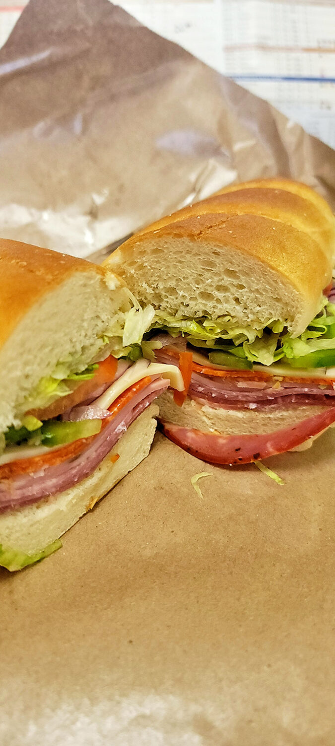 The Italian sub showcases perfect layering technique &ndash; a architectural marvel of meats, cheese and veggies on fresh bread.