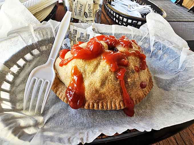 A proper Cornish pasty with ketchup &ndash; the crimped edge originally served as a handle for miners with coal-dusted hands.