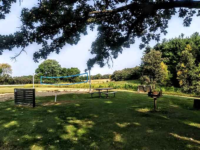 This picnic area comes with a volleyball net because apparently some people have energy left after hiking, which seems suspicious.