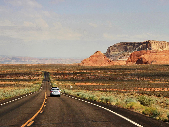Sunset transforms the desert palette, shifting from bright ochres to deep purples as shadows lengthen across the ancient landscape.