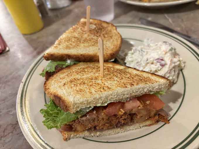 The Sloppy Joe arrives on toasted bread, messy and magnificent, exactly as this American classic should be served.