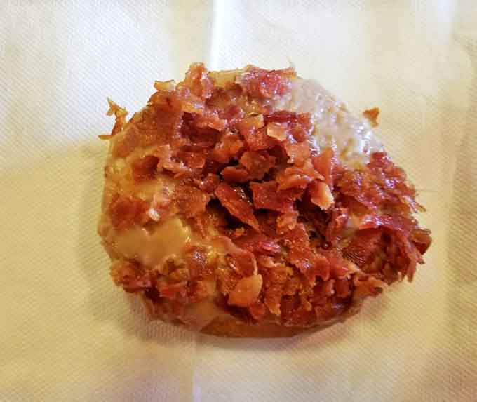 The maple bacon donut – where breakfast meets dessert in a relationship so perfect it should have its own reality show.