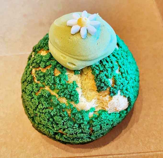 The matcha cream puff wears its vibrant green crown like royalty, promising earthy sweetness that will convert even matcha skeptics.