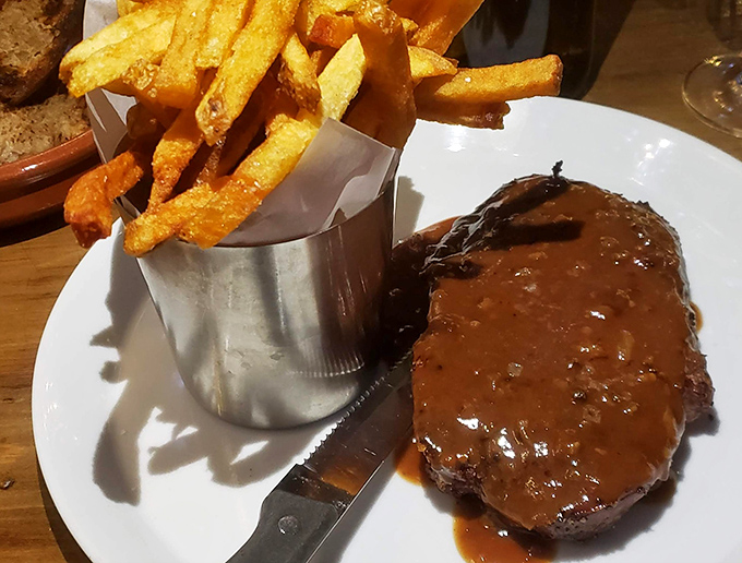 Comfort food elevated: Chaval's meatloaf glistens with savory glaze, while those crispy fries stand ready for their supporting role in this flavor drama.