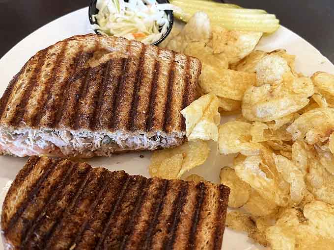 The tuna melt delivers that perfect marriage of flaky fish and melted cheese, pressed to crispy perfection between slices of golden bread.