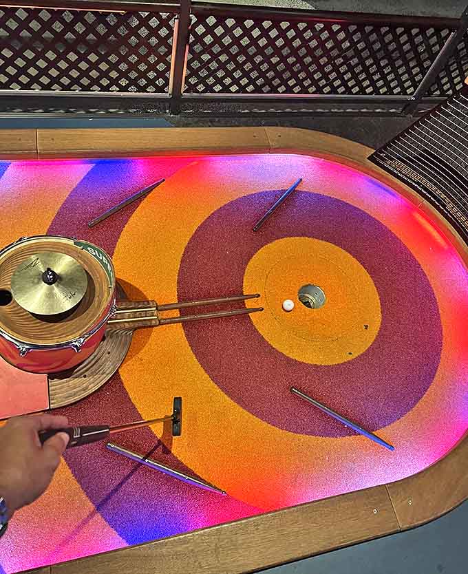 Psychedelic swirls and precision challenges combine on this hole, where your ball's journey is tracked by hidden technology beneath the vibrant surface.