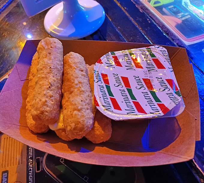 Golden-brown mozzarella sticks await their marinara bath &ndash; the perfect crispy, gooey fuel for conquering that next level.