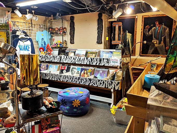 Vinyl records create a wall of musical history, while Elvis keeps a watchful eye on this treasure trove of melodic memories.