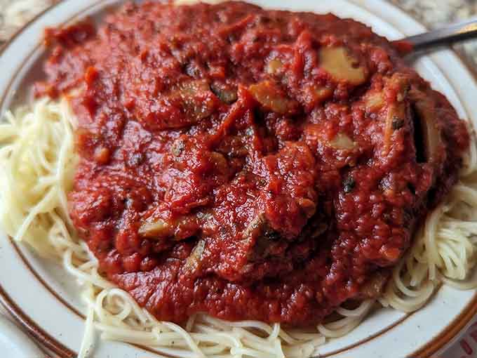 That meat sauce clings to every strand like it's been training for this moment its entire life, rich and ready.
