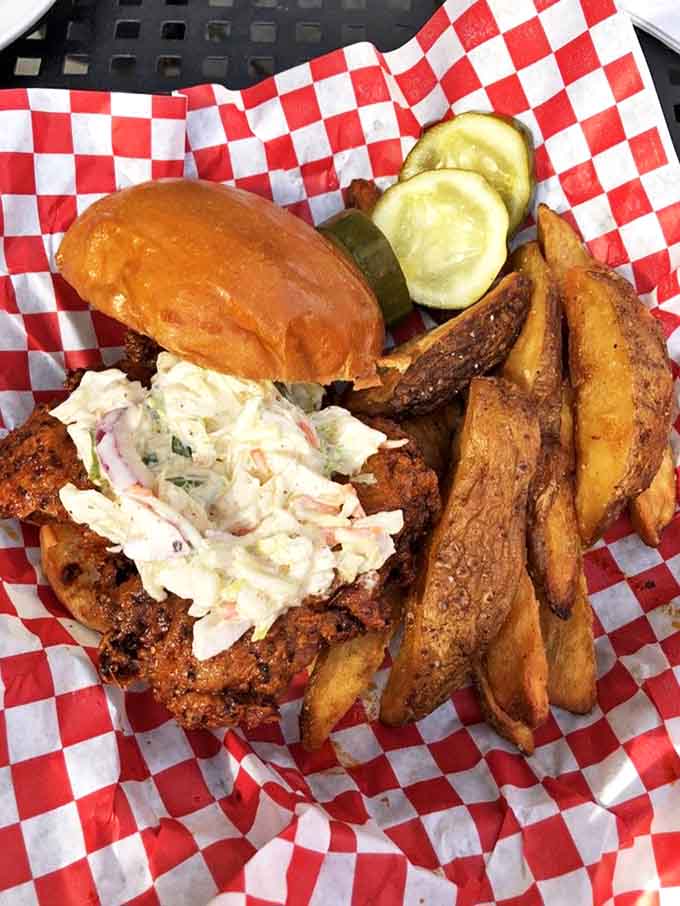 Nashville meets Champaign in this fiery creation&mdash;crispy chicken with that signature red glow, cooling slaw, and fries that beg to be dunked.