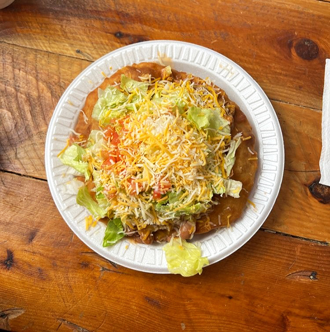 The Native taco showcases traditional fry bread topped with savory layers of beans, meat, cheese, and fresh vegetables &ndash; a meal fit for royalty.