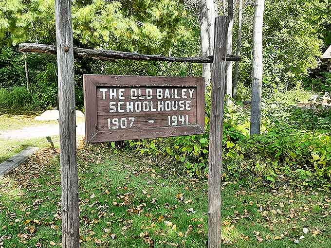 The Old Bailey Schoolhouse sign stands as a humble reminder of simpler times in education. No smartphones, just slates and determination.