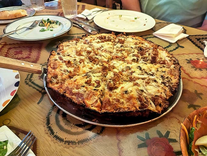 The legendary Satch-Pan Pizza with its caramelized edges and buttery crust&mdash;proof that sometimes the best things in life are simple but perfect.