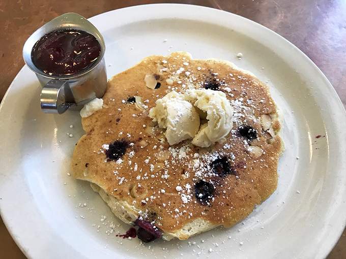 Cloud-like pancakes dotted with plump blueberries and crowned with melting butter &ndash; breakfast architecture at its finest!