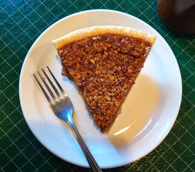 Pecan pie so perfect it makes Southern grandmothers nervously check their recipe cards. Caramelized pecan glory in every bite.