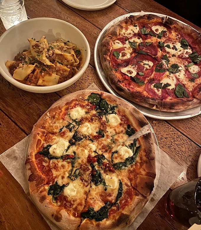 A symphony of textures and flavors &ndash; two pizzas showcasing the kitchen's versatility alongside pasta that would make an Italian grandmother weep with joy.