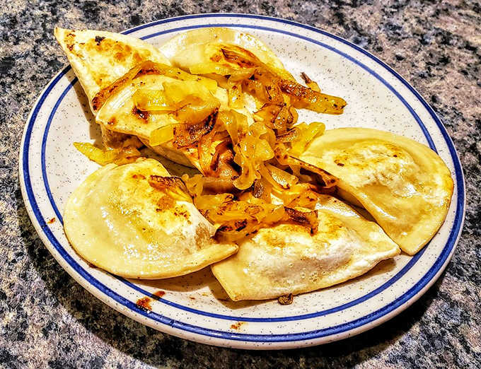 Pierogies that would make your grandmother jealous, topped with onions caramelized to the edge of sweet surrender.