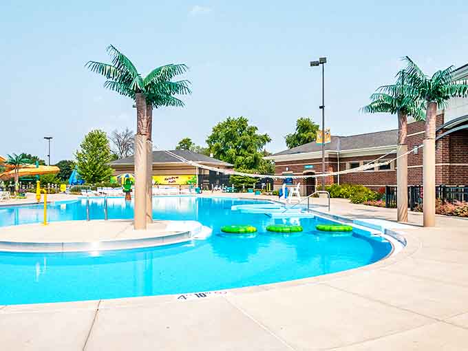 The main pool area gleams under the sun, complete with palm trees that create the perfect tropical illusion for your Instagram feed.