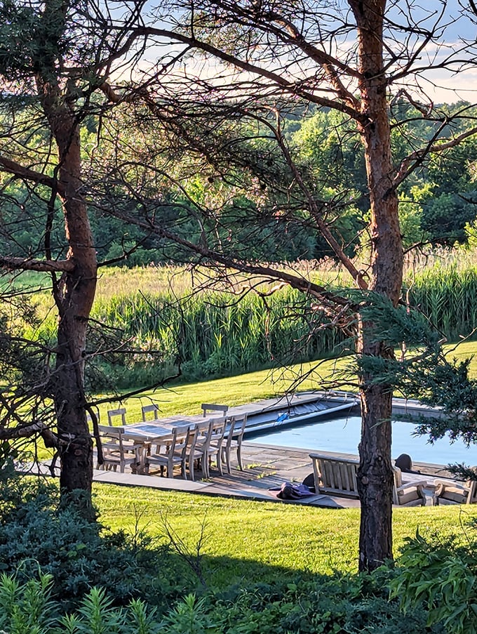 Someone's living the dream with this poolside setup. The water's nice, but that backdrop is the real showstopper.