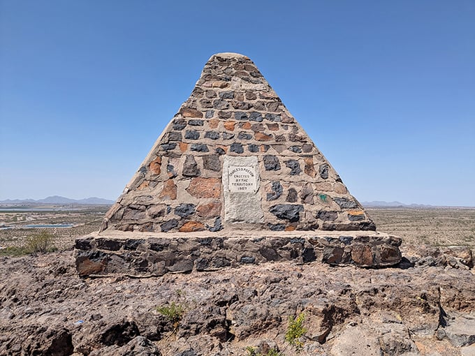 Poston Butte's distinctive stone pyramid monument stands sentinel over the desert landscape, honoring Arizona's founding father with panoramic views worth the climb.