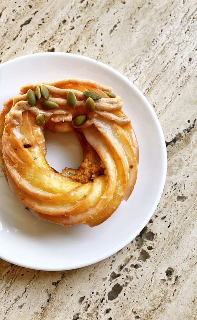 The pumpkin pie cruller transforms fall's favorite gourd into spirals of spiced perfection, topped with pepitas for that extra textural pop.