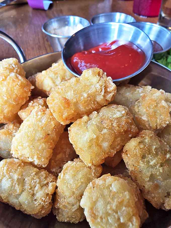 Golden, crispy tater tots &ndash; the ultimate finger food for gamers who refuse to choose between sustenance and keeping their hands on the controls.