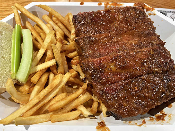 A rack of ribs that would make a vegetarian question their life choices, accompanied by perfectly crisp fries.