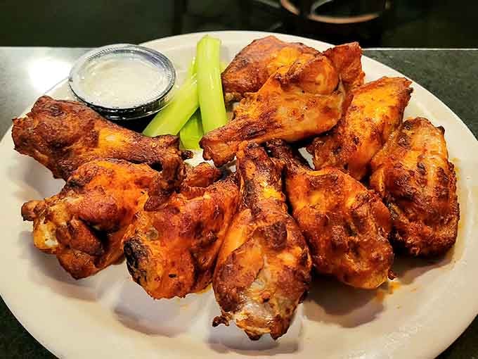 These buffalo wings arrive glistening and golden, ready to deliver the perfect combination of heat and flavor with every bite.