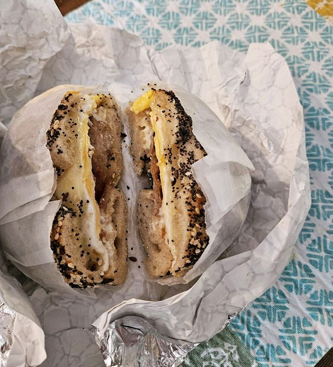 Breakfast sandwich nirvana achieved! The perfect marriage of toasty bagel, melty cheese, and savory fillings makes mornings worth facing.