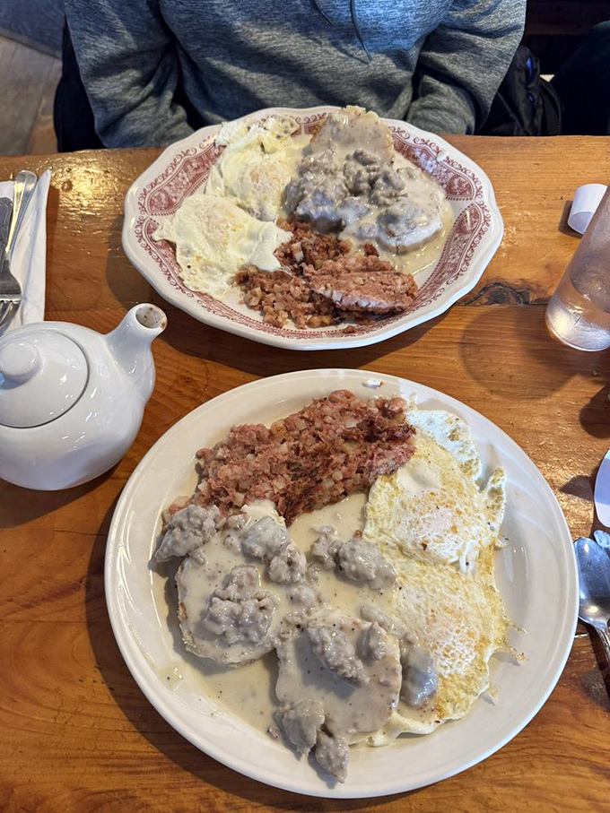 Biscuits swimming in sausage gravy alongside corned beef hash &ndash; a savory symphony that makes you question why lunch and dinner even exist.