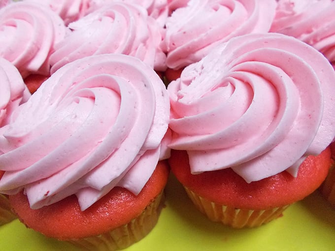These strawberry cupcakes wear their pink frosting like Dolly Parton wears sequins: proudly, generously, and absolutely perfectly.