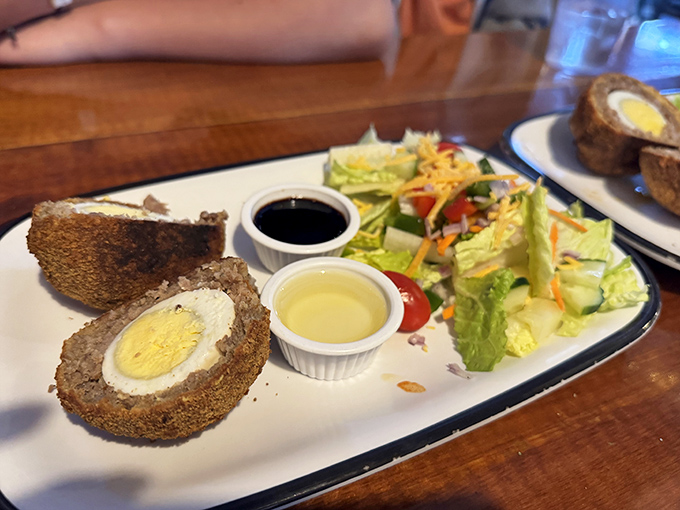 The Scotch egg &ndash; a perfect handheld bite of Scottish tradition with its crispy exterior giving way to savory sausage and perfectly cooked egg.