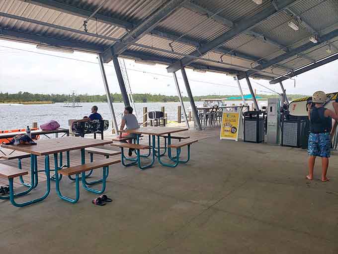 After conquering the water obstacles, visitors recharge under the covered pavilion, swapping tales of triumph and spectacular wipeouts.