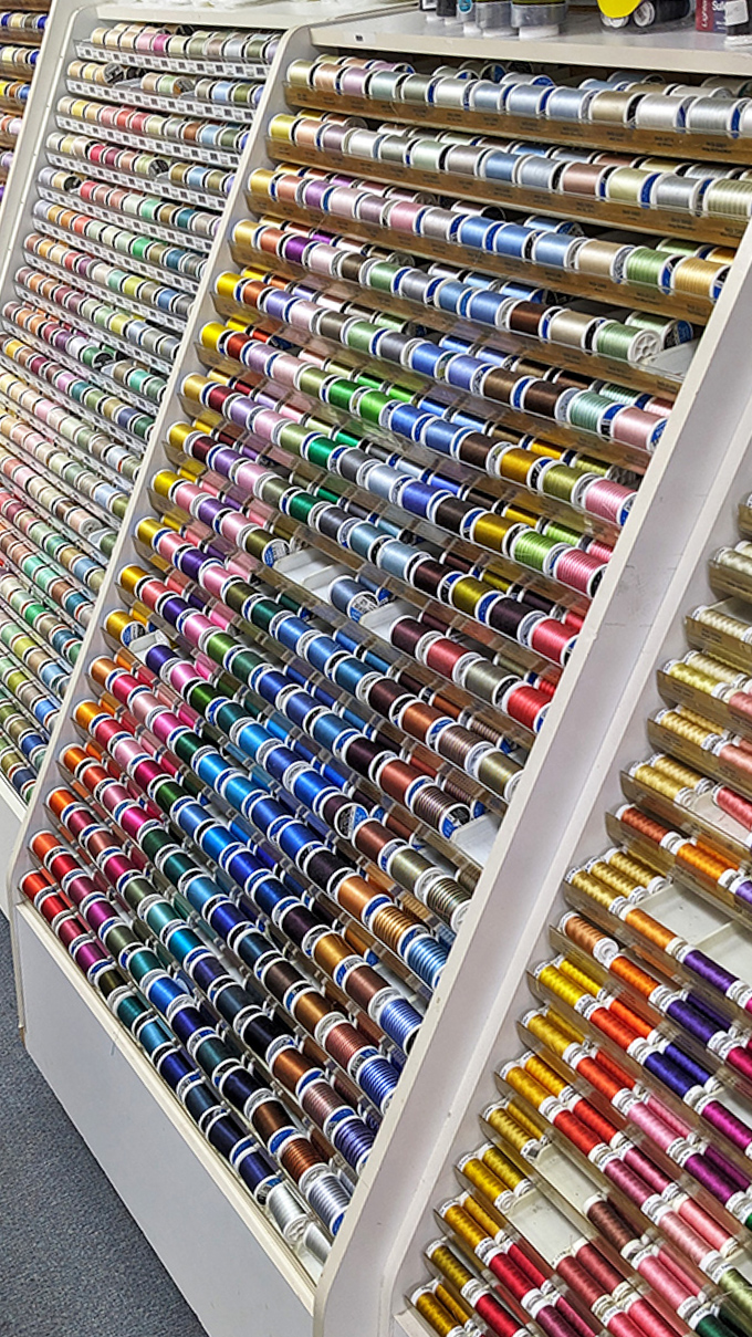 Thread heaven! More colors than a rainbow convention, organized with the precision of a NASA engineer.