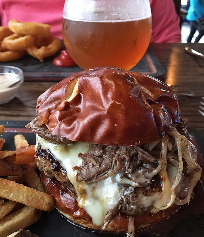 Pairing this burger masterpiece with a cold craft beer is like finding the perfect dance partner at a wedding.
