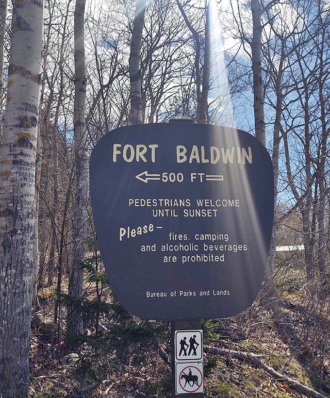The simple wooden sign marks the entrance to a remarkable journey through time &ndash; 500 feet to history hiding in plain sight.