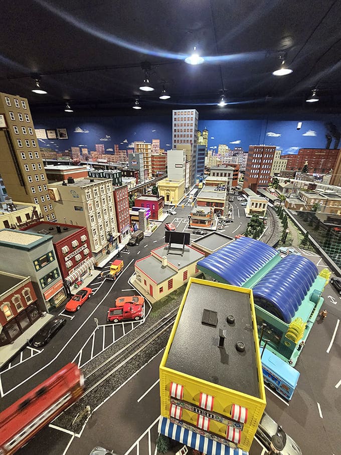 The miniature downtown skyline lights up as day turns to night, creating a magical urban landscape that rivals its full-sized inspiration.