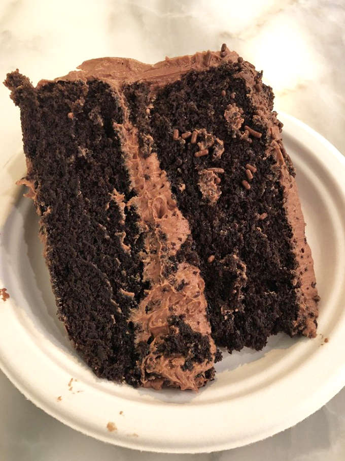 This cross-section reveals the architectural genius of proper German Chocolate Cake, where every layer plays its part in dessert perfection.