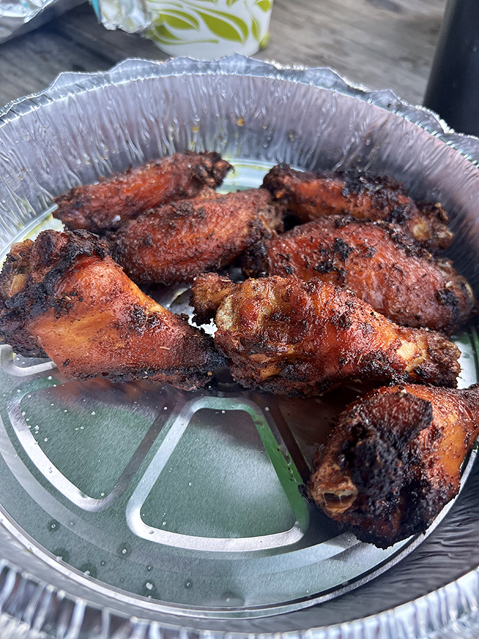 These aren't just wings &ndash; they're smoke-kissed flavor bombs with a mahogany exterior that signals the perfect balance of char and tenderness.